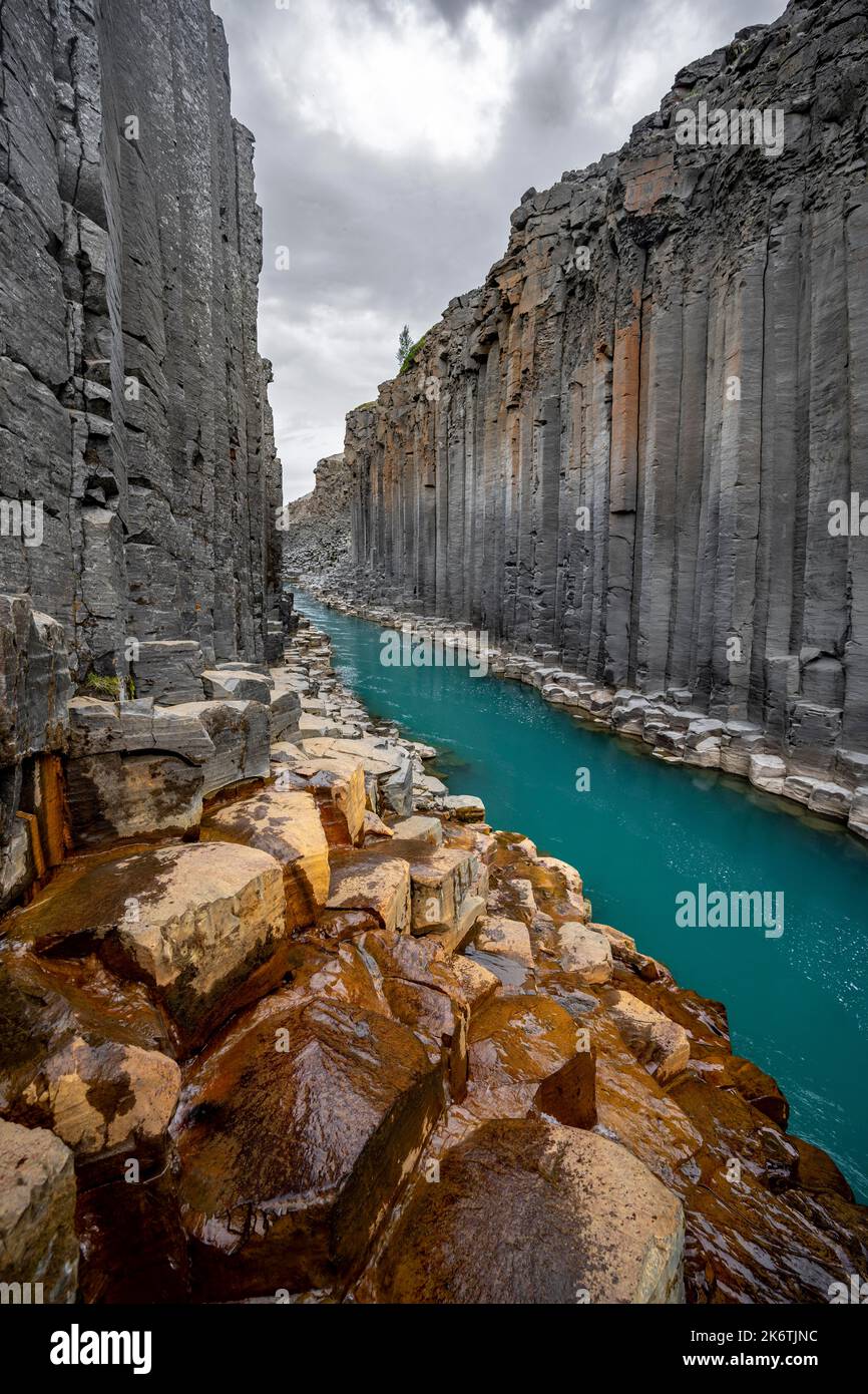 Stuolagil Canyon, turquoise river between basalt columns, Egilsstadir ...