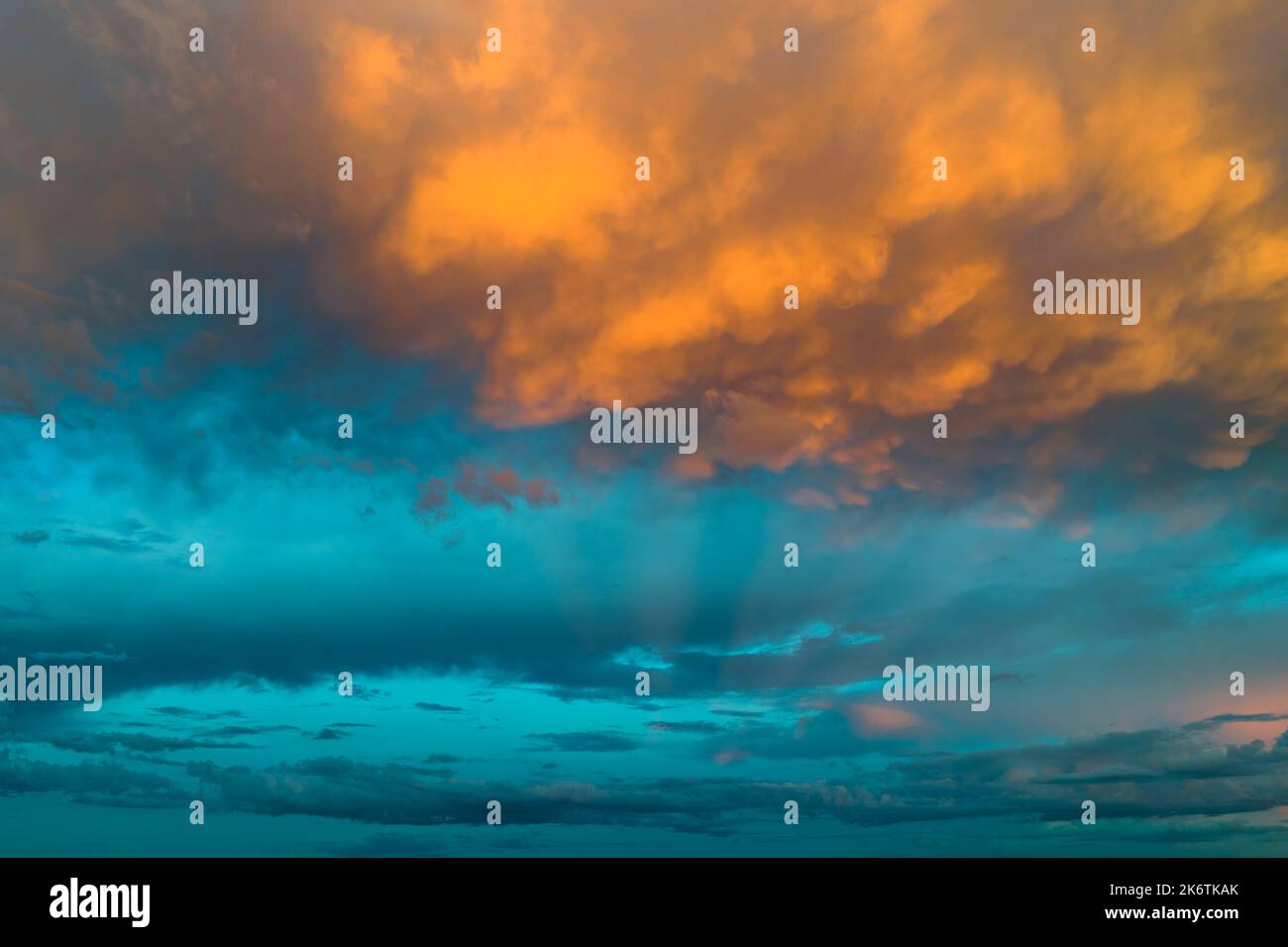 Colorful evening landscape with soft pastel coloured clouds on ...