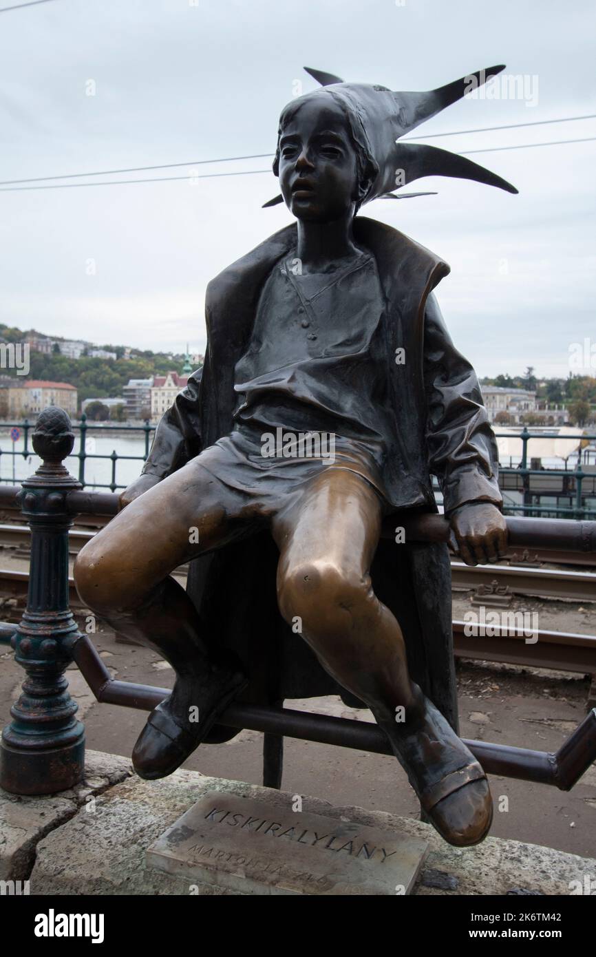 Little Princess - Kiskirálylány - statue sitting on the railings of the Danube promenade in ...