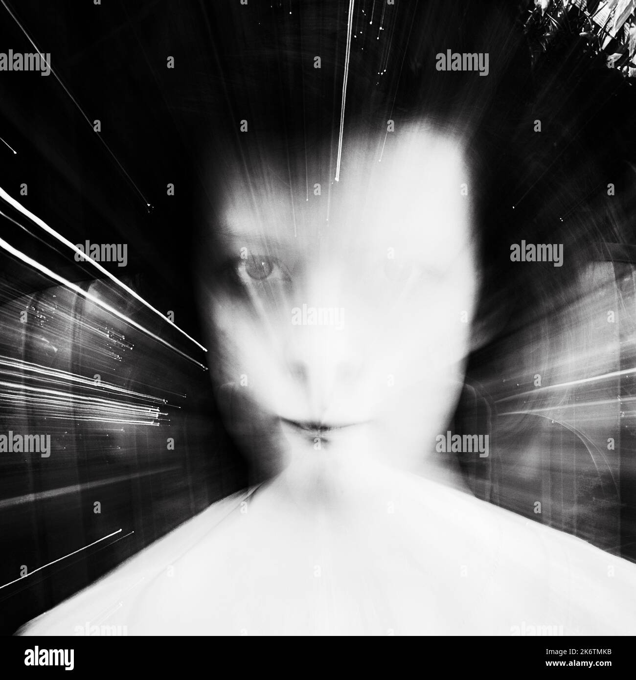 Portrait of a young woman, intense gaze, zoom effect, symbol image ...