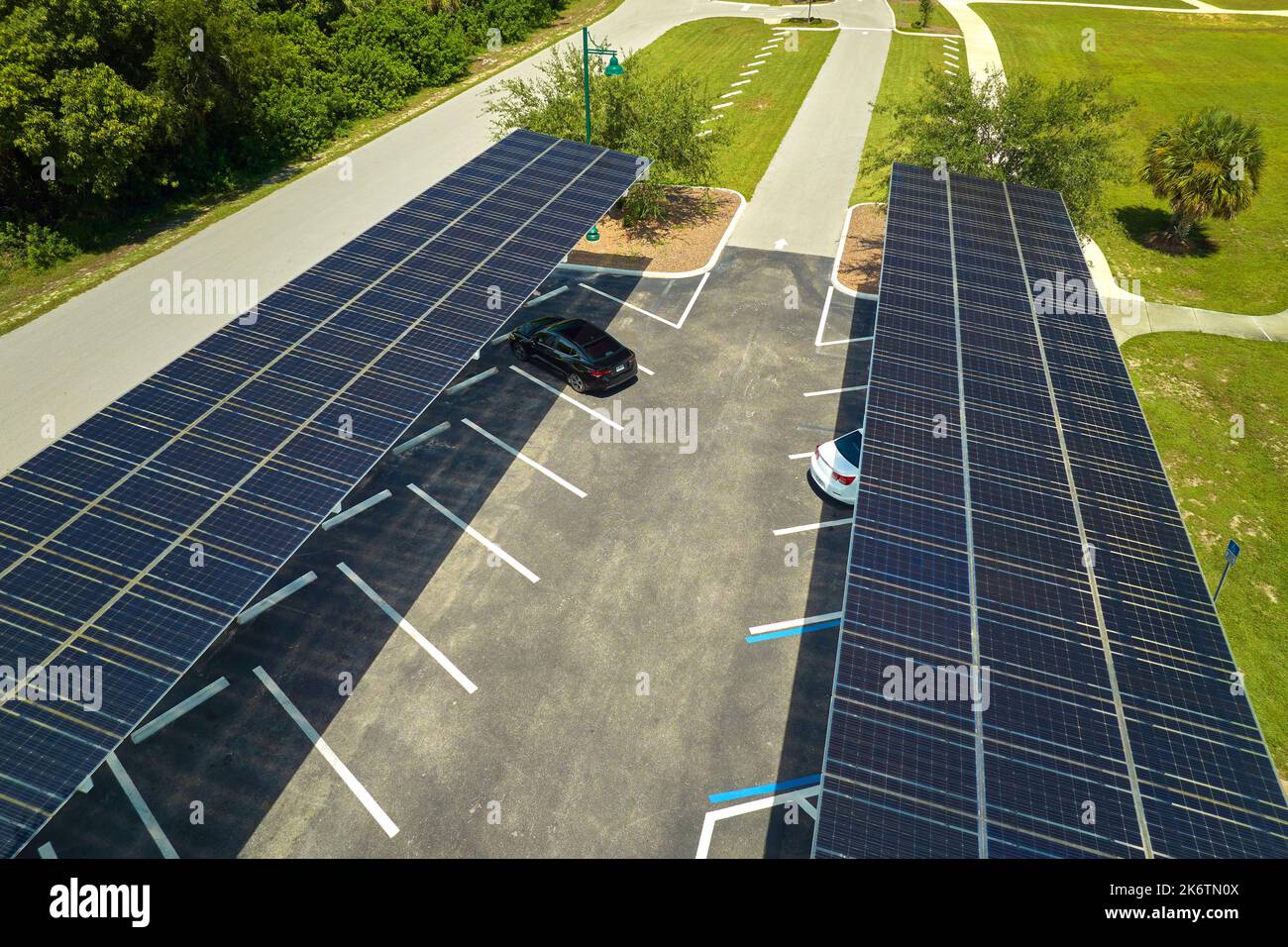 Solar panels installed over parking lot for parked cars for effective ...