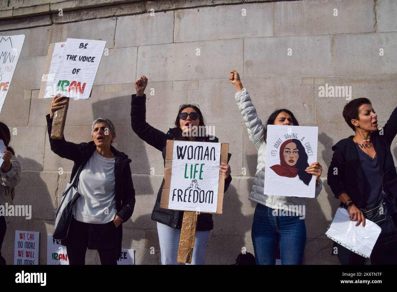 London, UK. 15th Oct, 2022. A protester holds a "Woman, life, freedom ...
