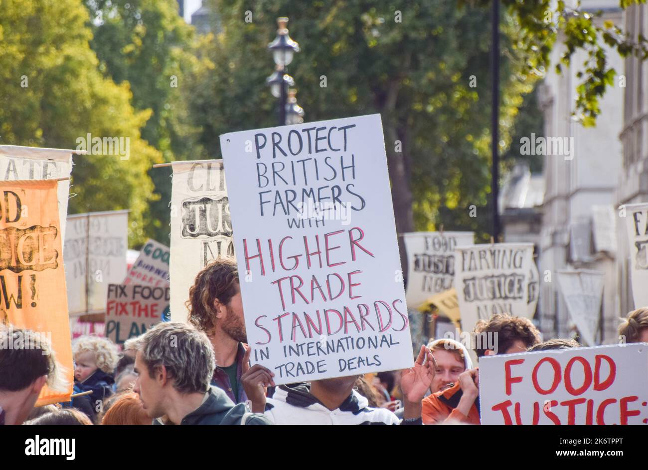 London, UK. 15th Oct, 2022. A protester holds a placard which states ...