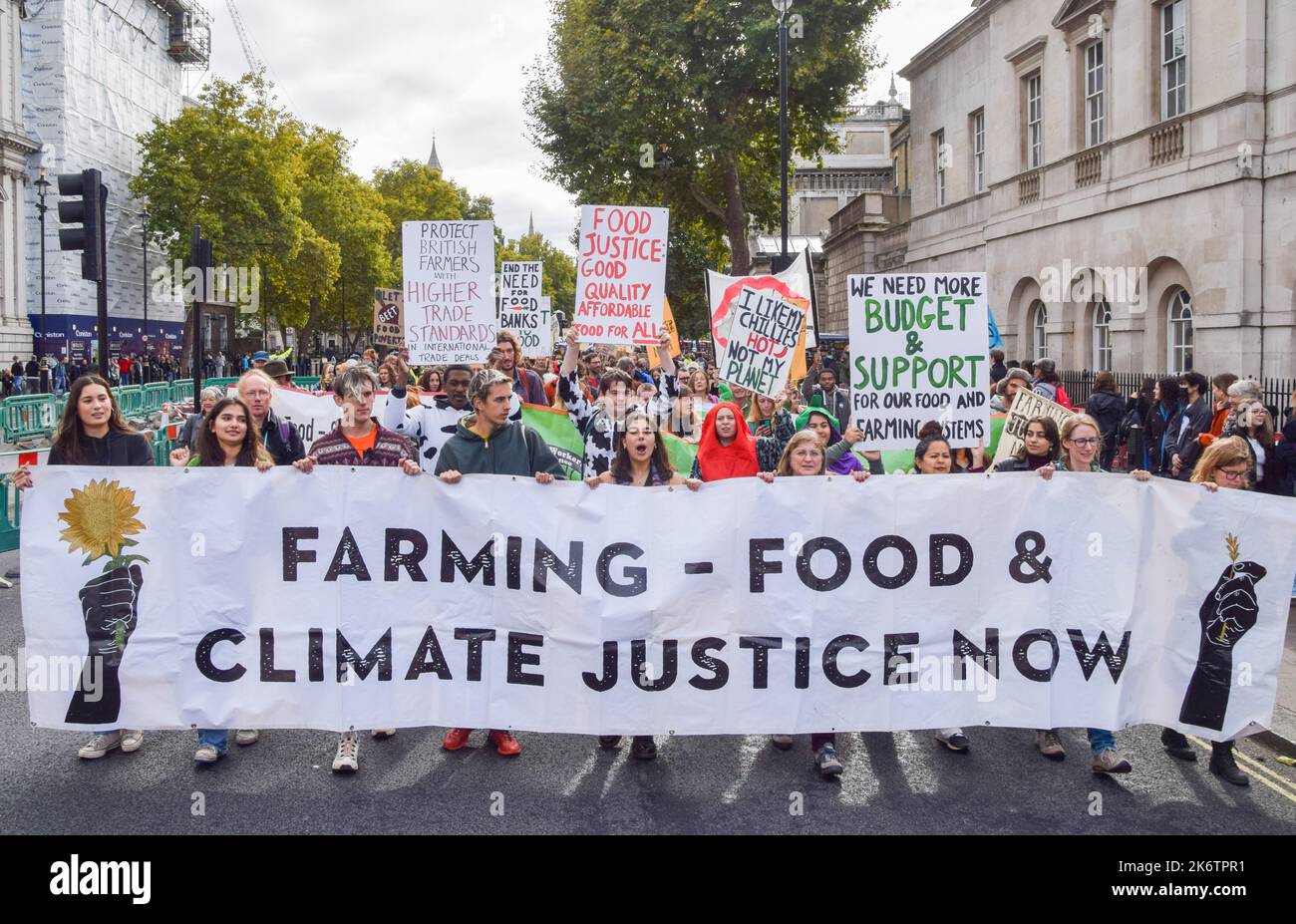 London, UK. 15th Oct, 2022. Protesters hold a banner which states ...