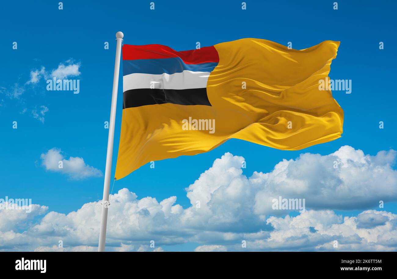 flag of Chukotko-Kamchatkan peoples Manchu people at cloudy sky ...
