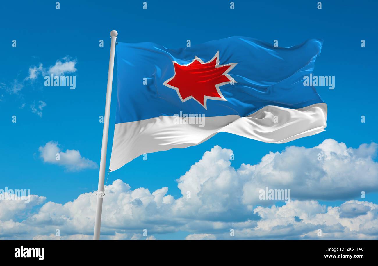 flag of Chukotko-Kamchatkan peoples Oroks at cloudy sky background ...