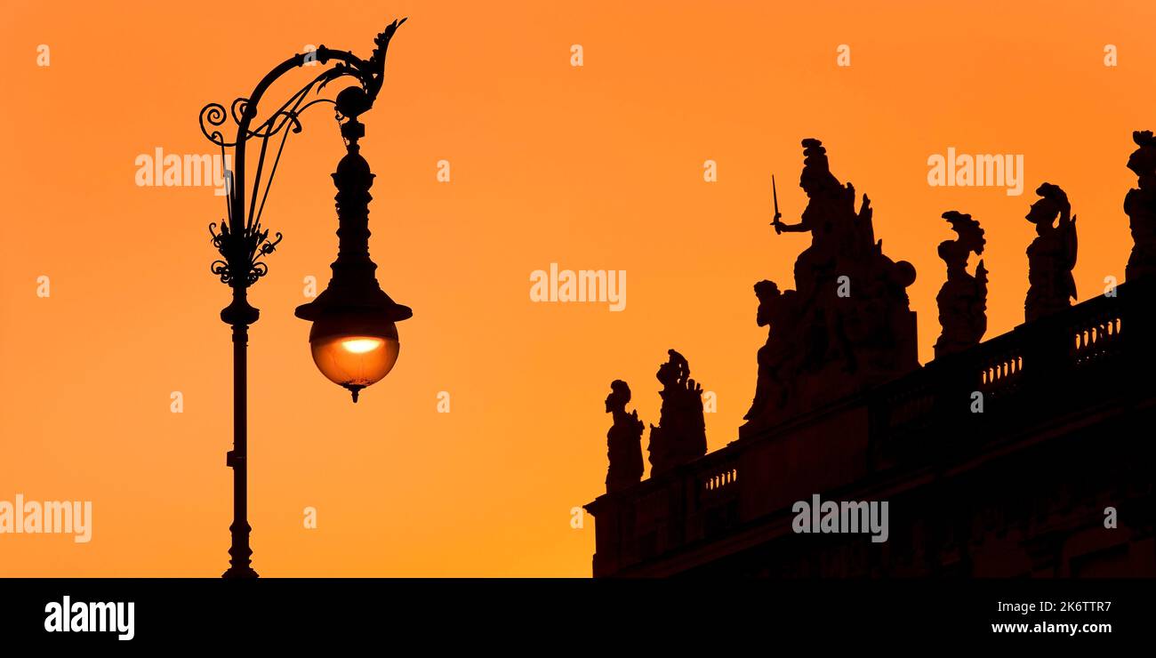 Old Berlin gas lantern in the street Unter den Linden at sunset at the ...