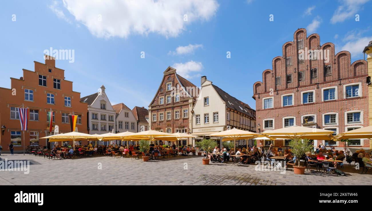Historic merchants' houses, town hall and street cafe on the market ...
