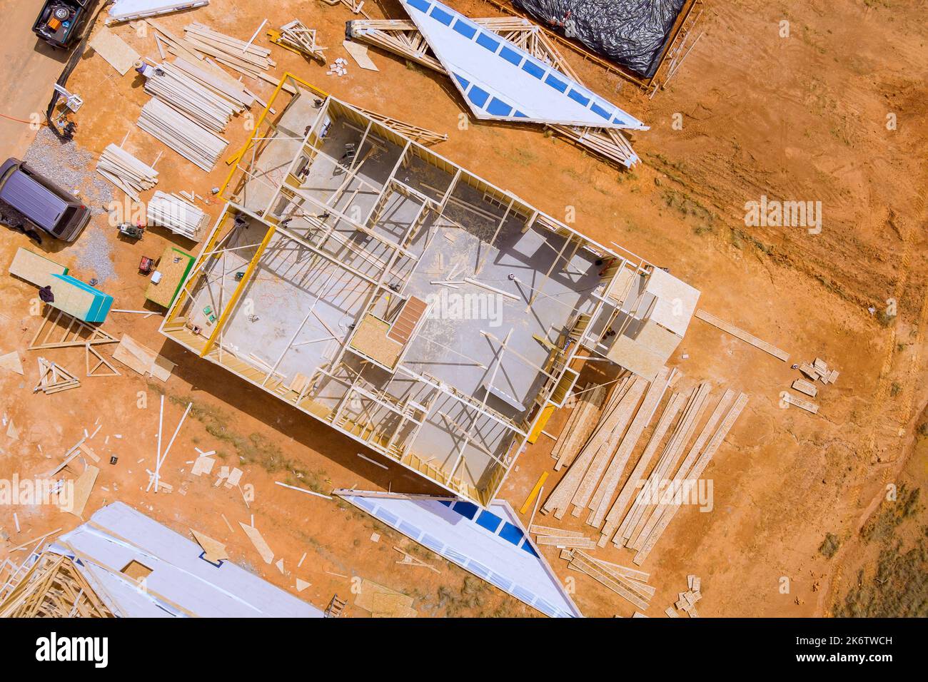 View top from an aerial perspective construction framing beam development of unfinished wooden ...