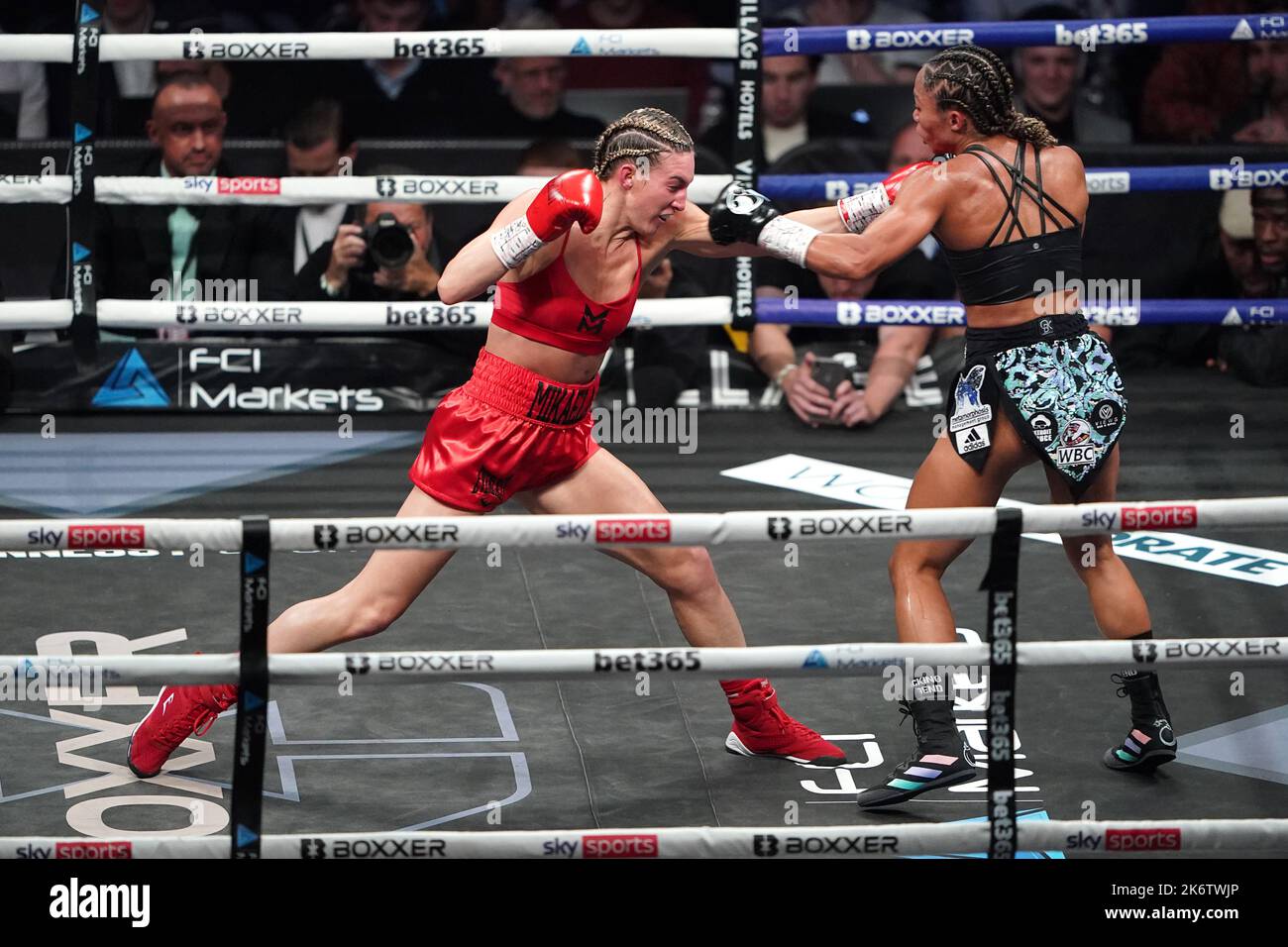 Alycia Baumgardner and Mikaela Mayer exchange punches during their ...
