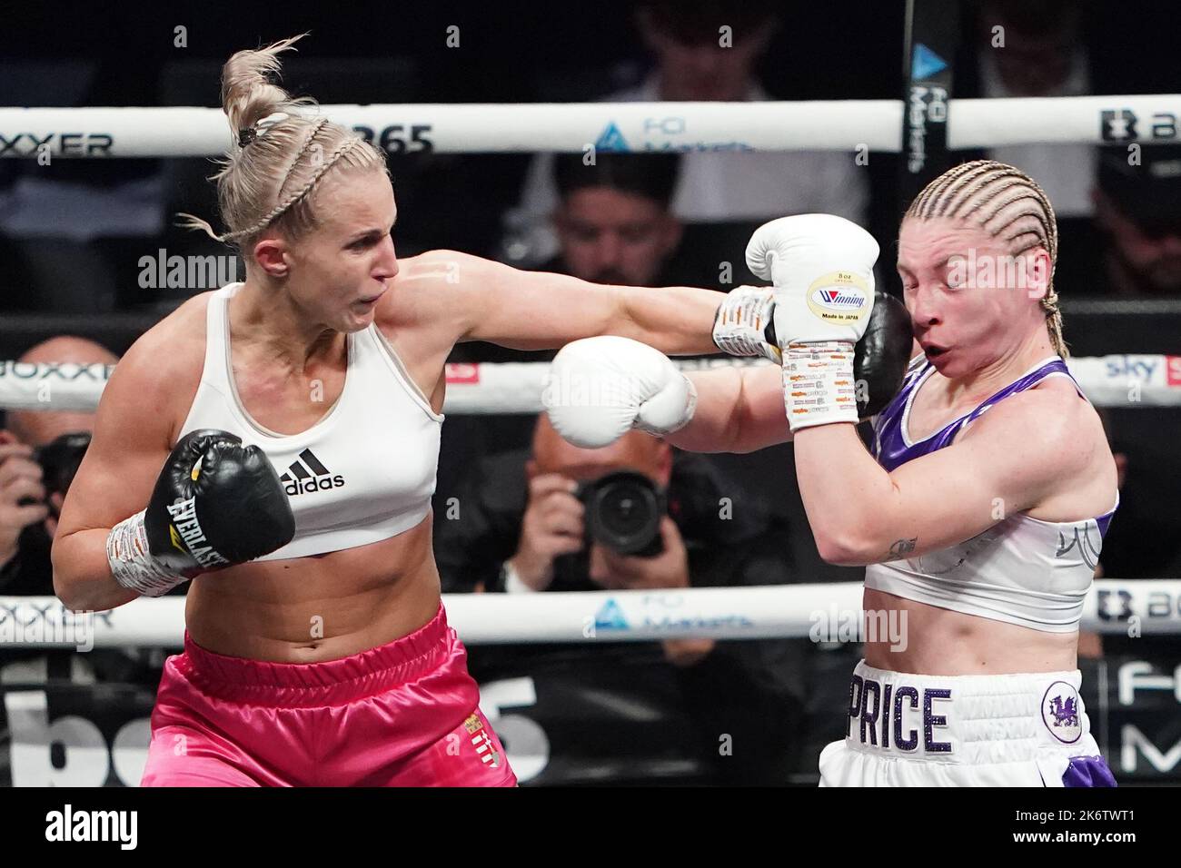 Lauren Price and Timea Belik exchange punches during their welterweight fight at The O2, London ...