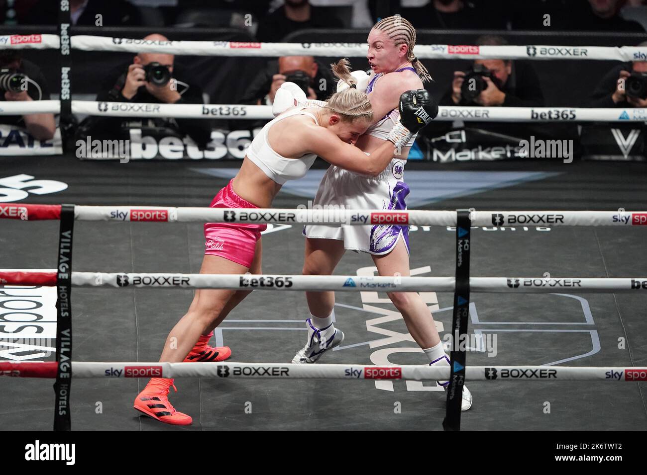 Lauren Price and Timea Belik exchange punches during their welterweight fight at The O2, London ...