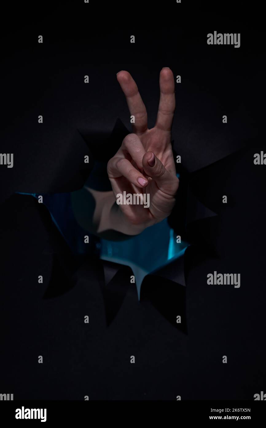 Woman hand over black isolated background showing 2 fingers Stock Photo ...