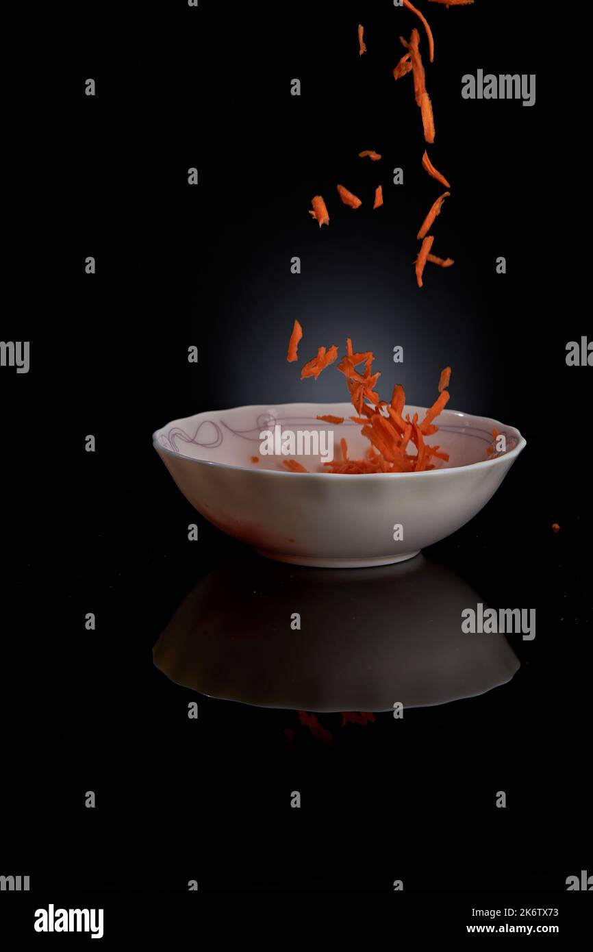 Grated carrot falling from top hi-res stock photography and images - Alamy
