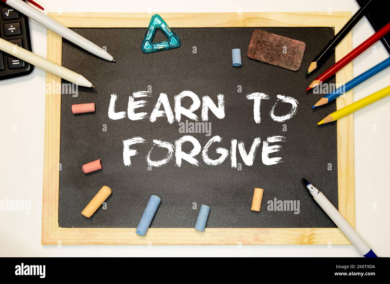 Text Learn to Forgive written with golden letters on a red heart Stock ...