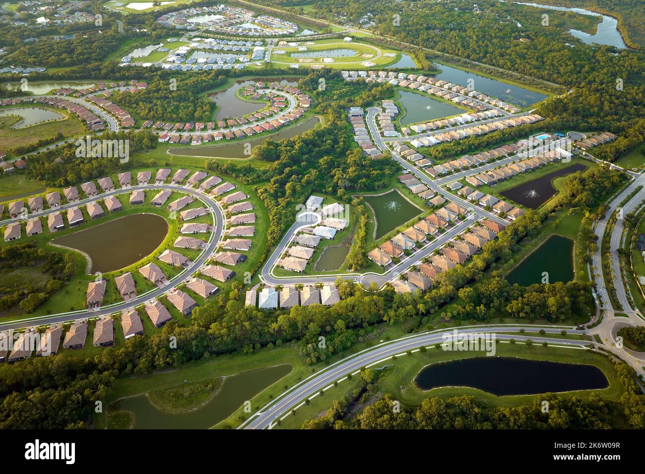 Aerial view of tightly located family houses in Florida closed suburban ...