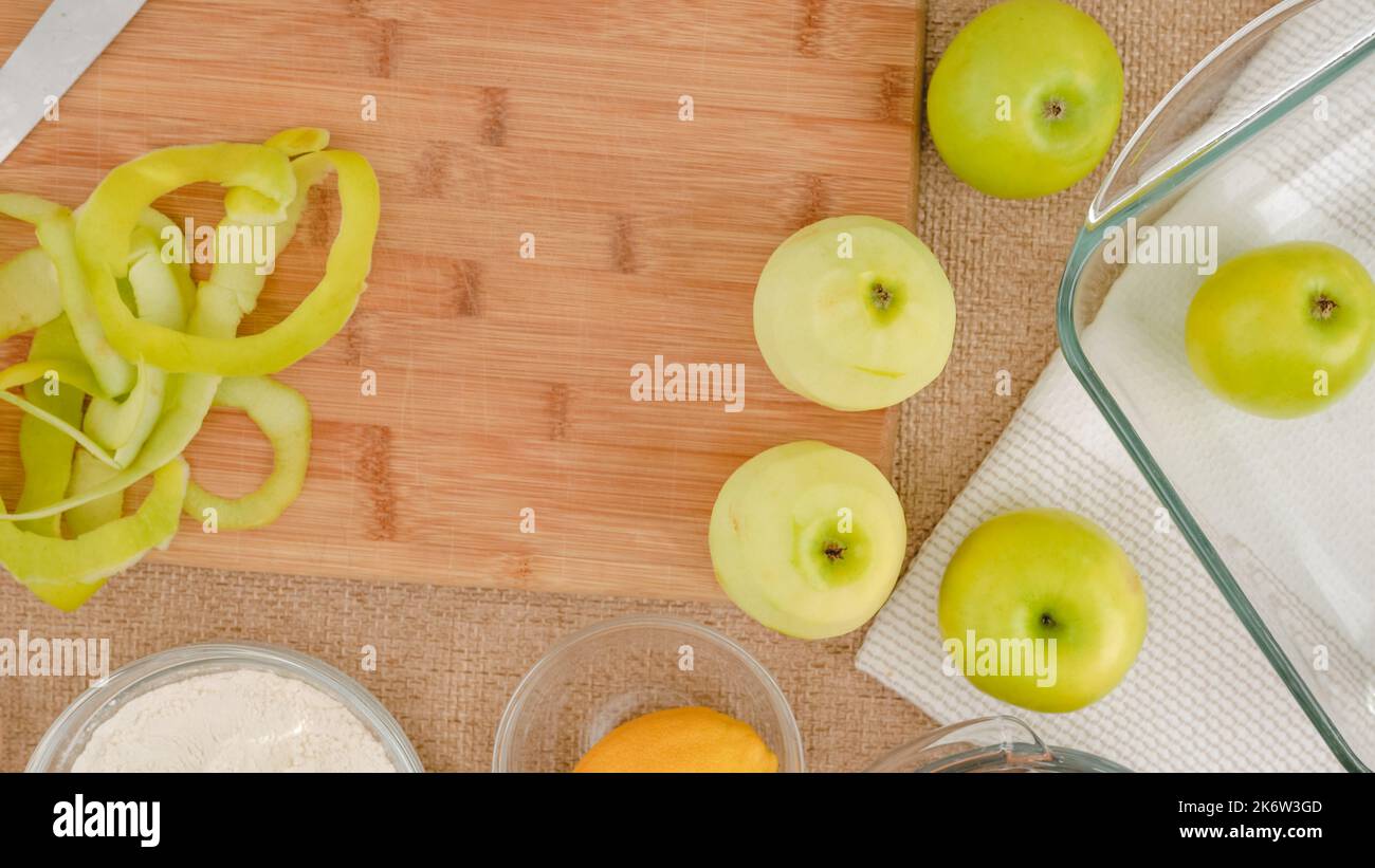 Apple cake with biscuit base recipe. Peeled green apples close up on a ...