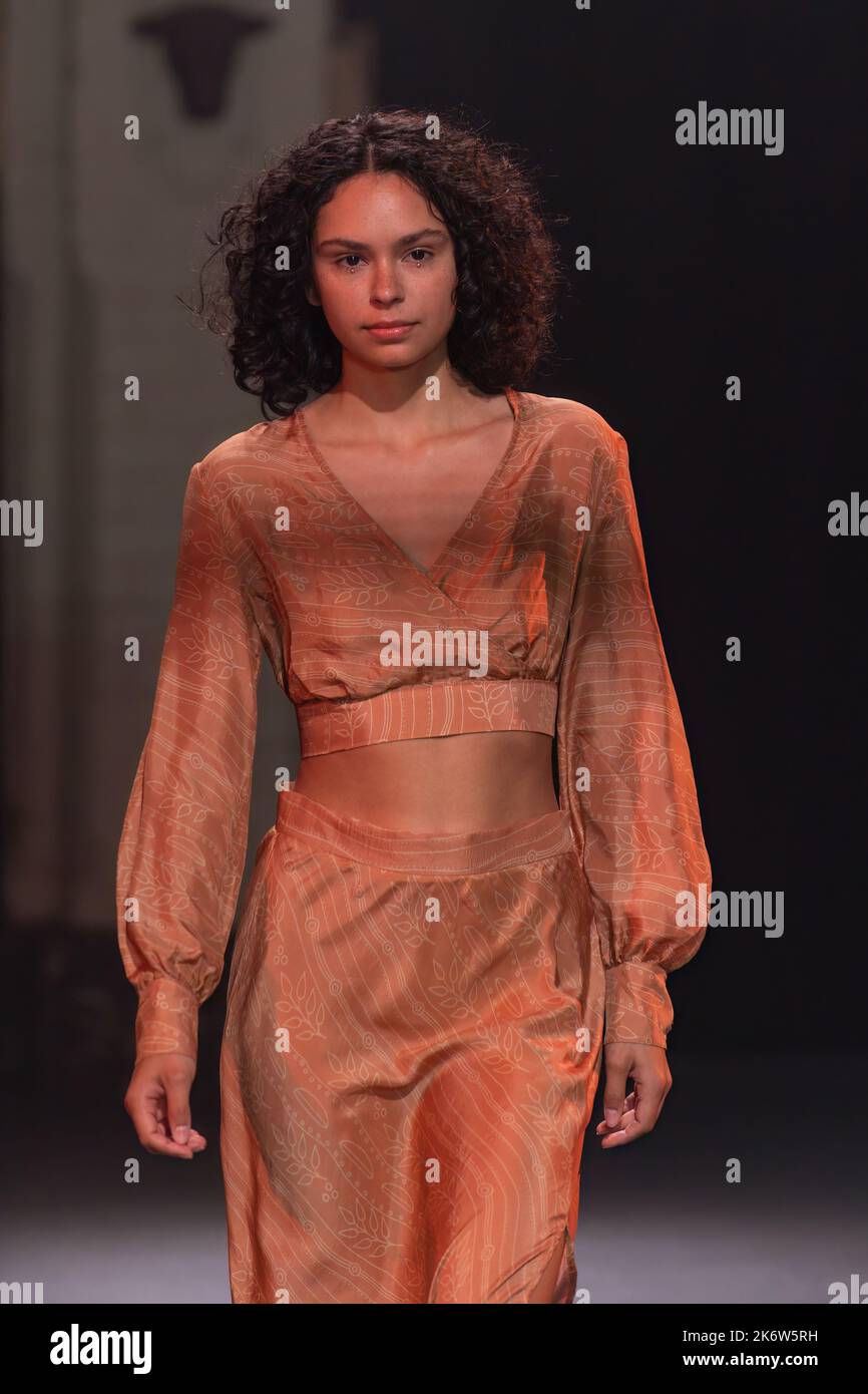 A model dressed in a design by Amber Days during the Ganbu Marra runway ...