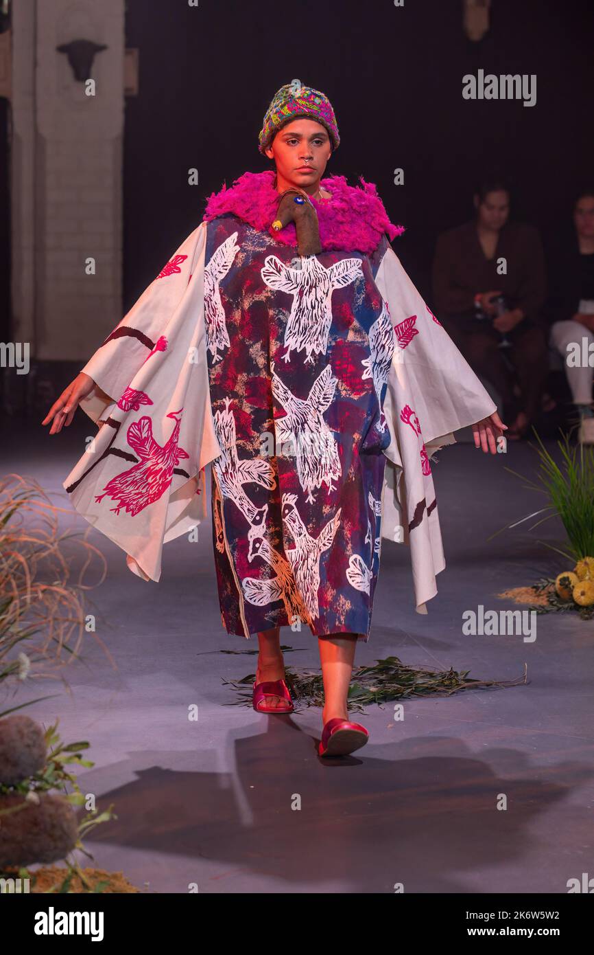A model dressed in a design by Yarrenyty Arltere Artists during the ...