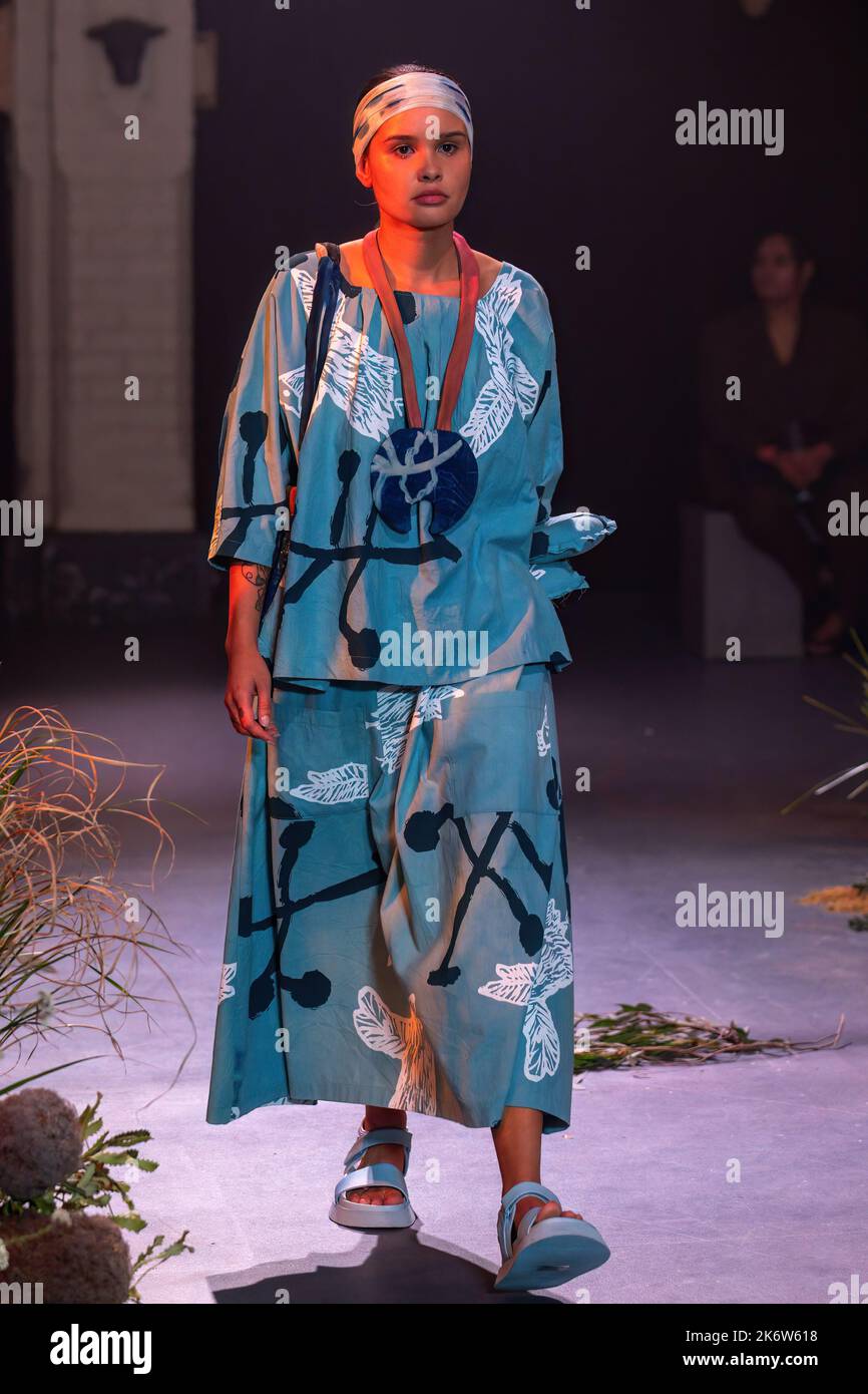 A model dressed in a design by Yarrenyty Arltere Artists during the ...