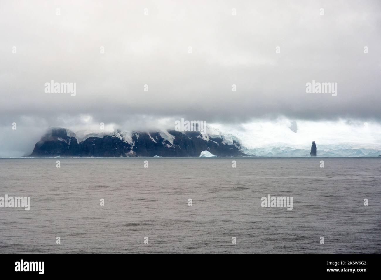 Astrolabe Needle rock monolith rising 50m out of water near cloud ...