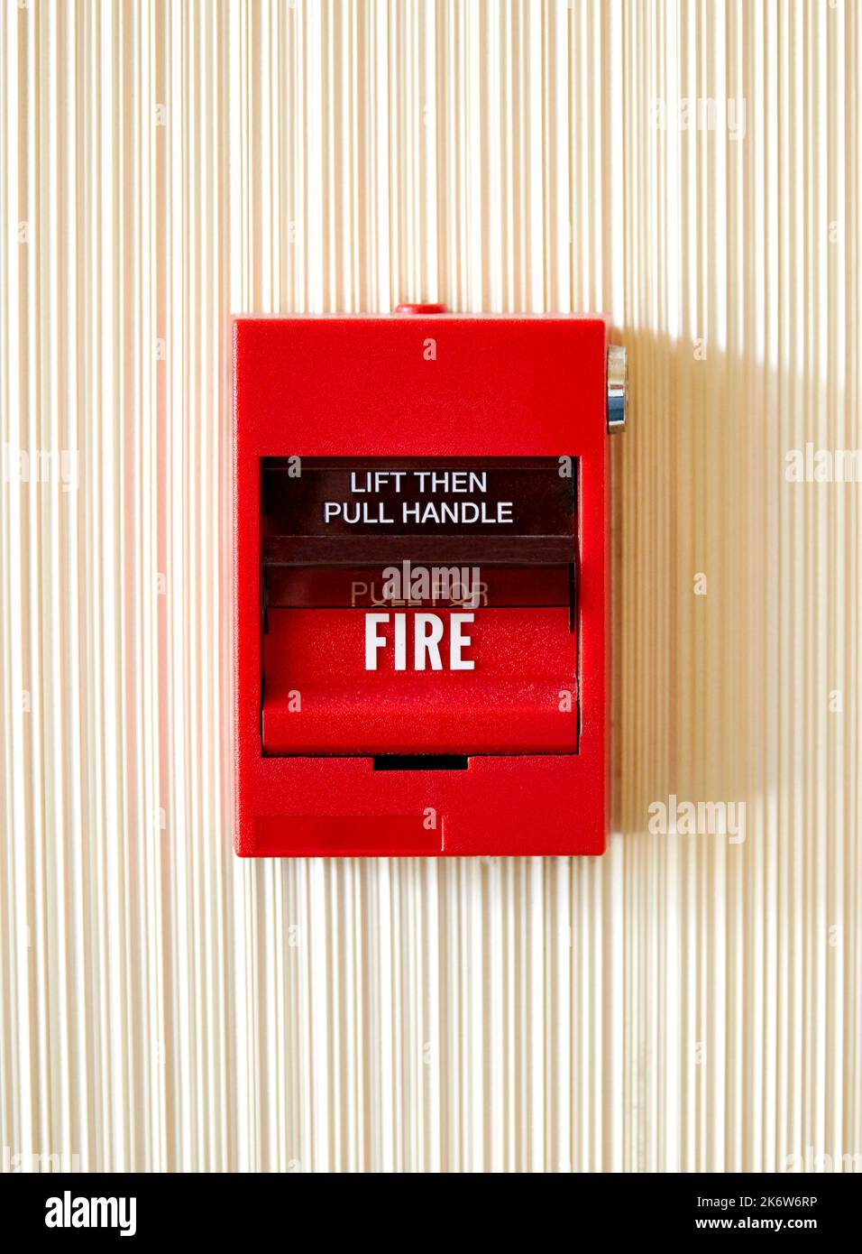 Emergency fire alarm handle mounted on wall Stock Photo - Alamy