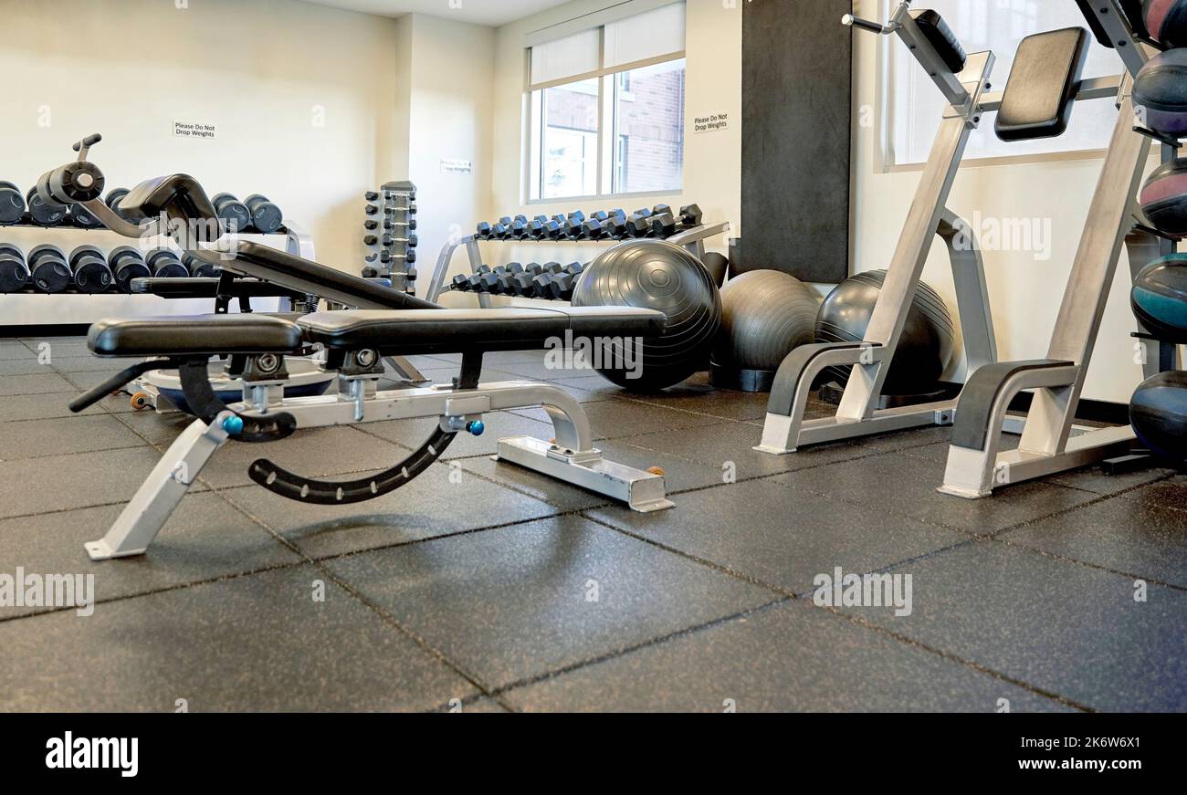 Fitness room with a variety of workout equipment Stock Photo - Alamy