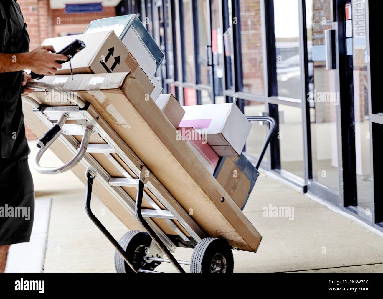 Various size boxes and packages on a hand truck to be delivered Stock ...