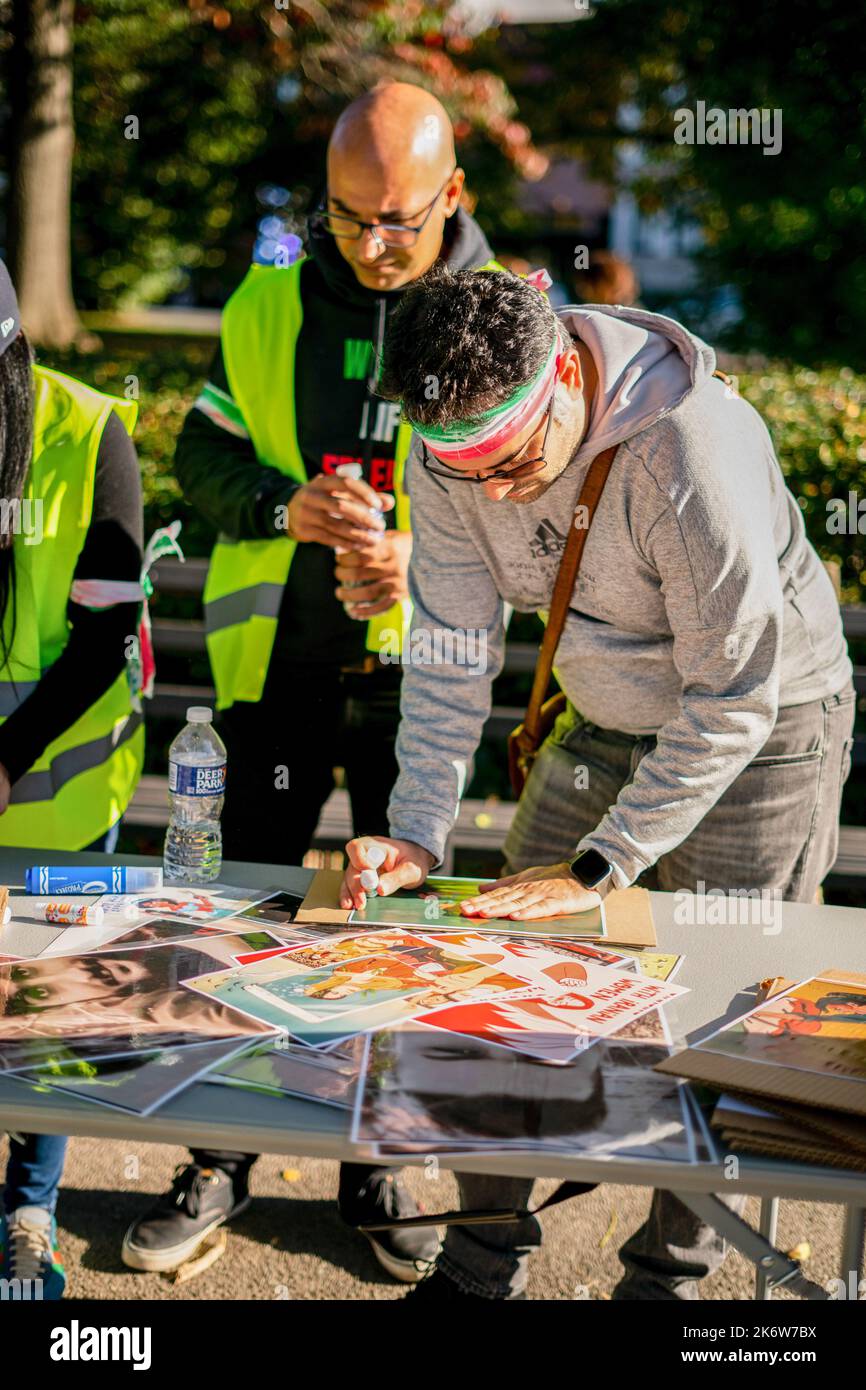 Washington DC, USA. 15th Oct, 2022. A man creates posters for the march ...
