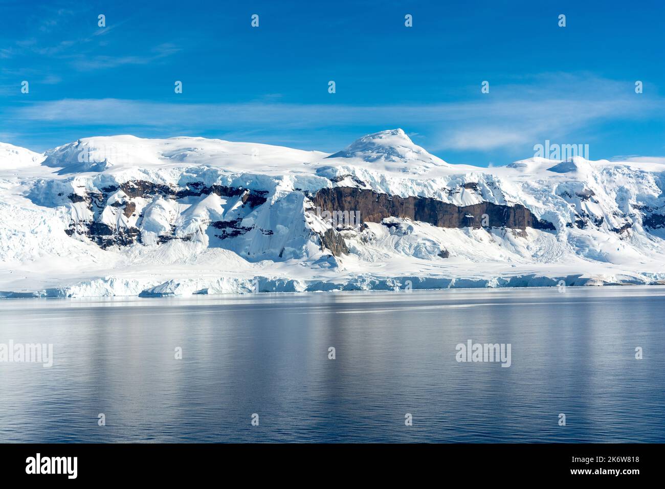 snow covered mountains and ice cliffs. gerlache strait. antarctic ...