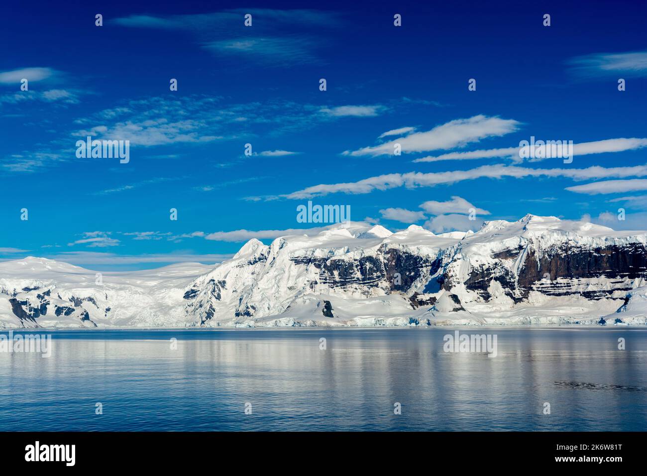 snow covered mountains and ice cliffs. gerlache strait. antarctic ...