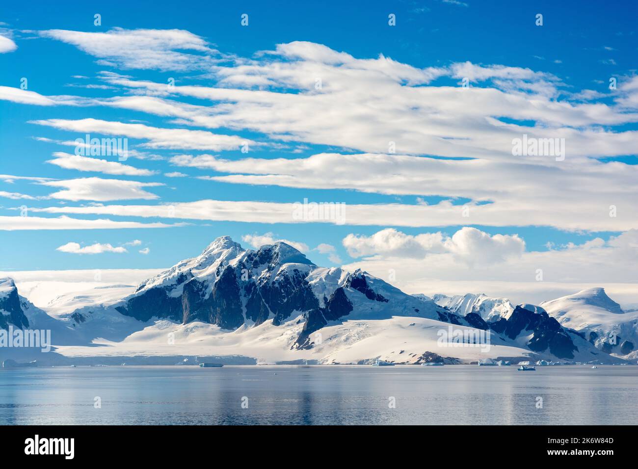 snow covered mountains and ice cliffs. gerlache strait. antarctic ...