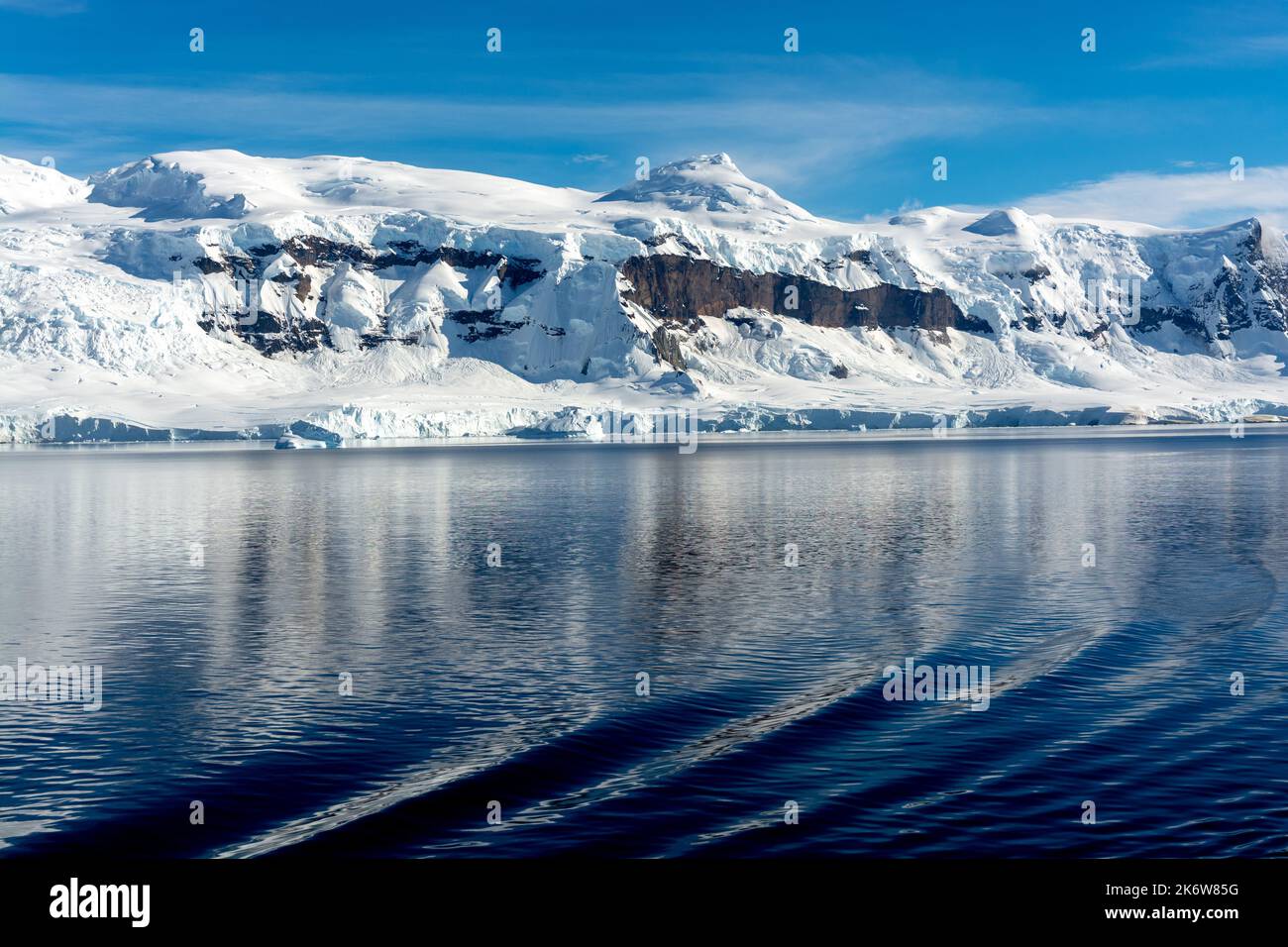 snow covered mountains and ice cliffs. gerlache strait. antarctic ...