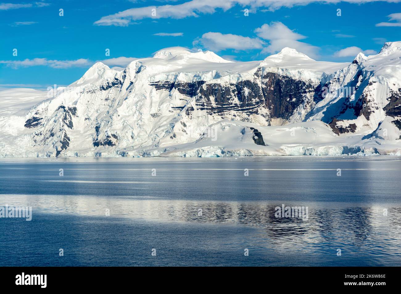 snow covered mountains and ice cliffs. gerlache strait. antarctic ...