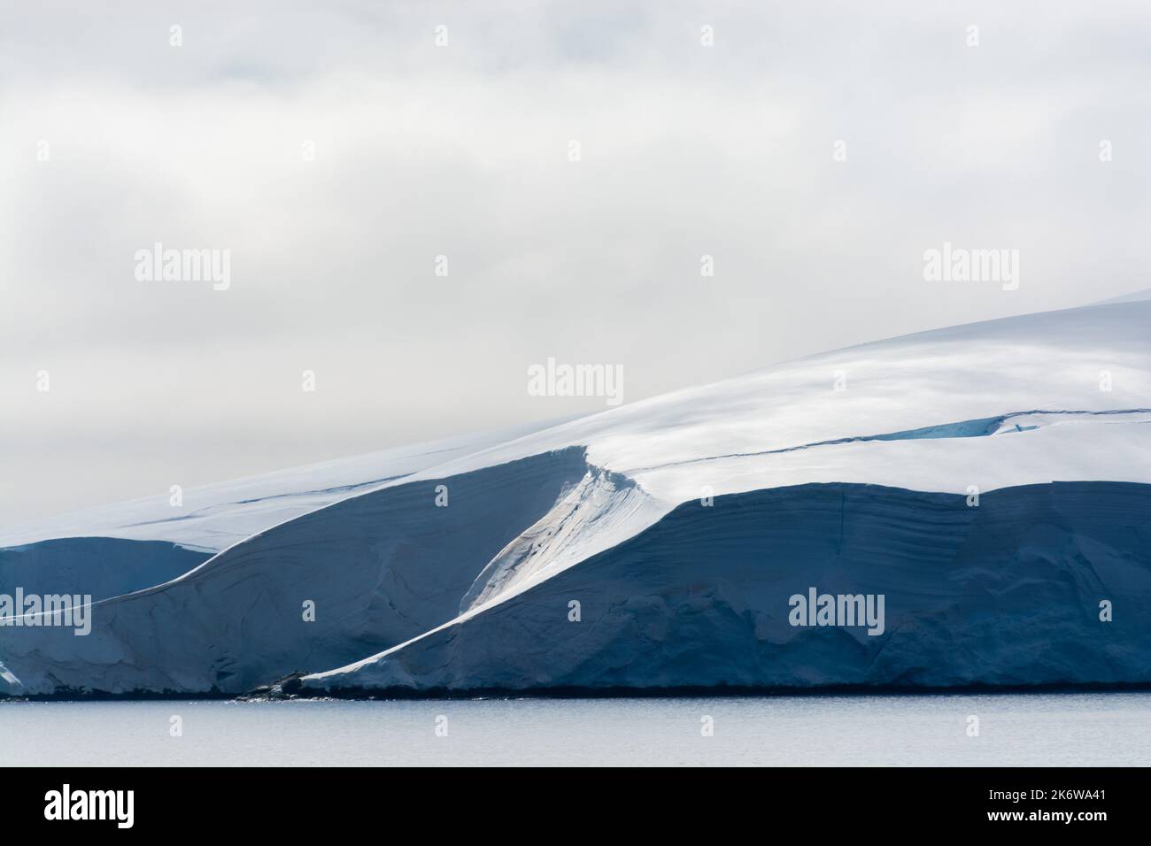 ice cliffs of snow covered shores and mountains of gerlache strait ...