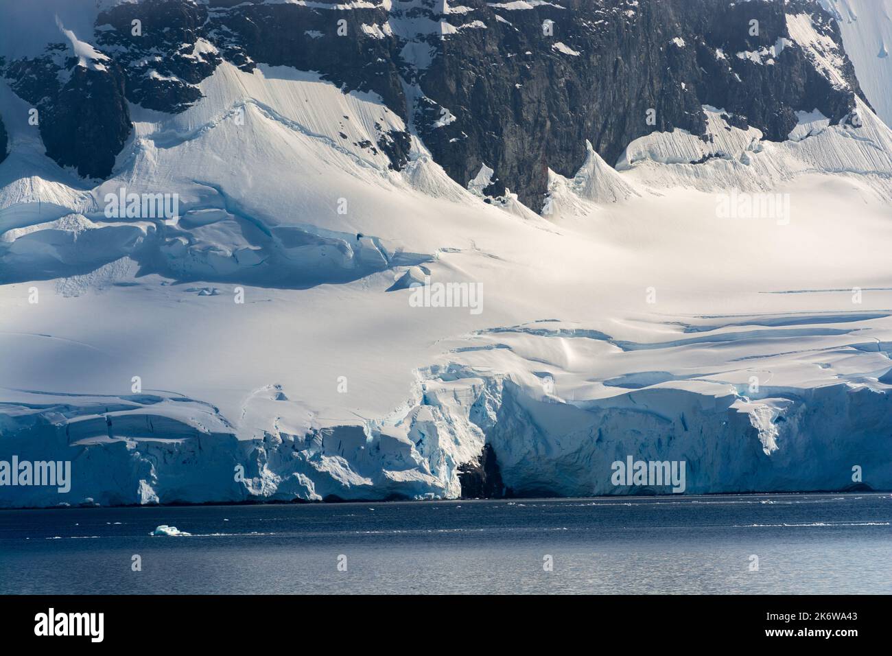 ice cliffs of snow covered shores and mountains of gerlache strait ...