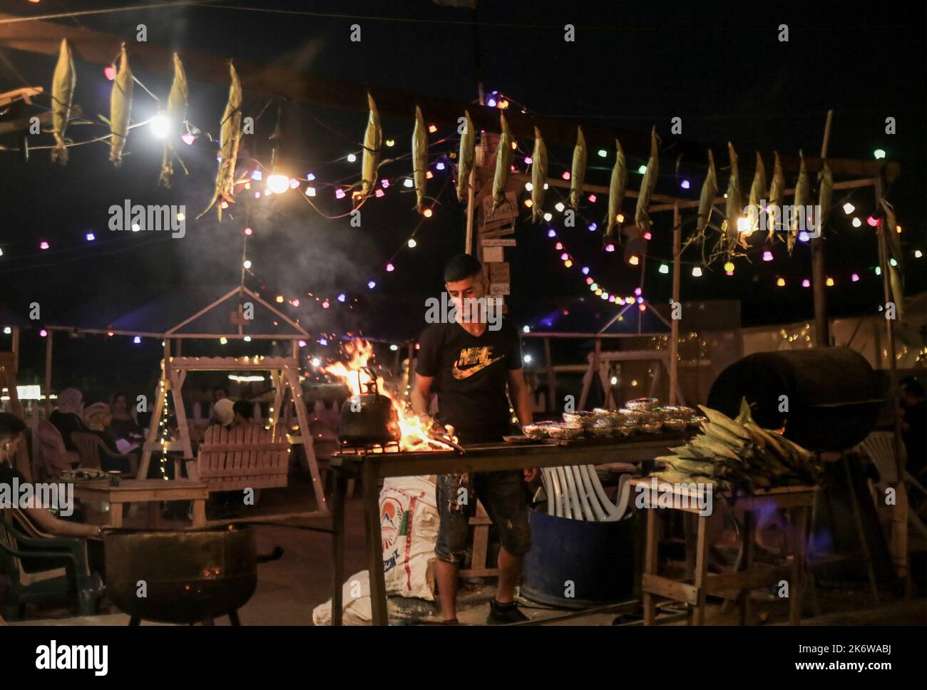 Gaza, Palestine. 15th Oct, 2022. A Palestinian man sells corn and ...