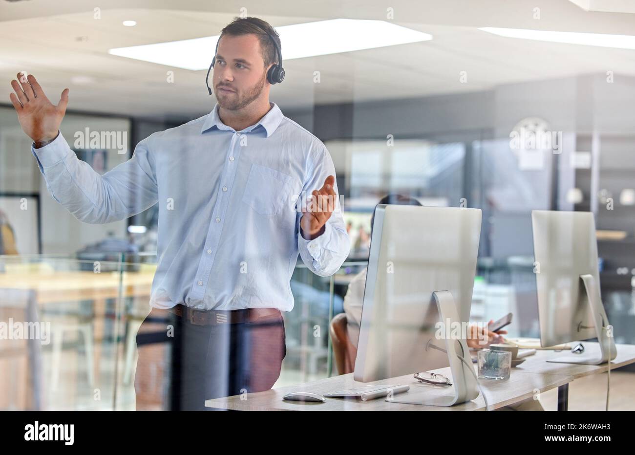 Let me explain this to you. a young businessman working in a call ... Let me explain this to you. a young businessman working in a call ...