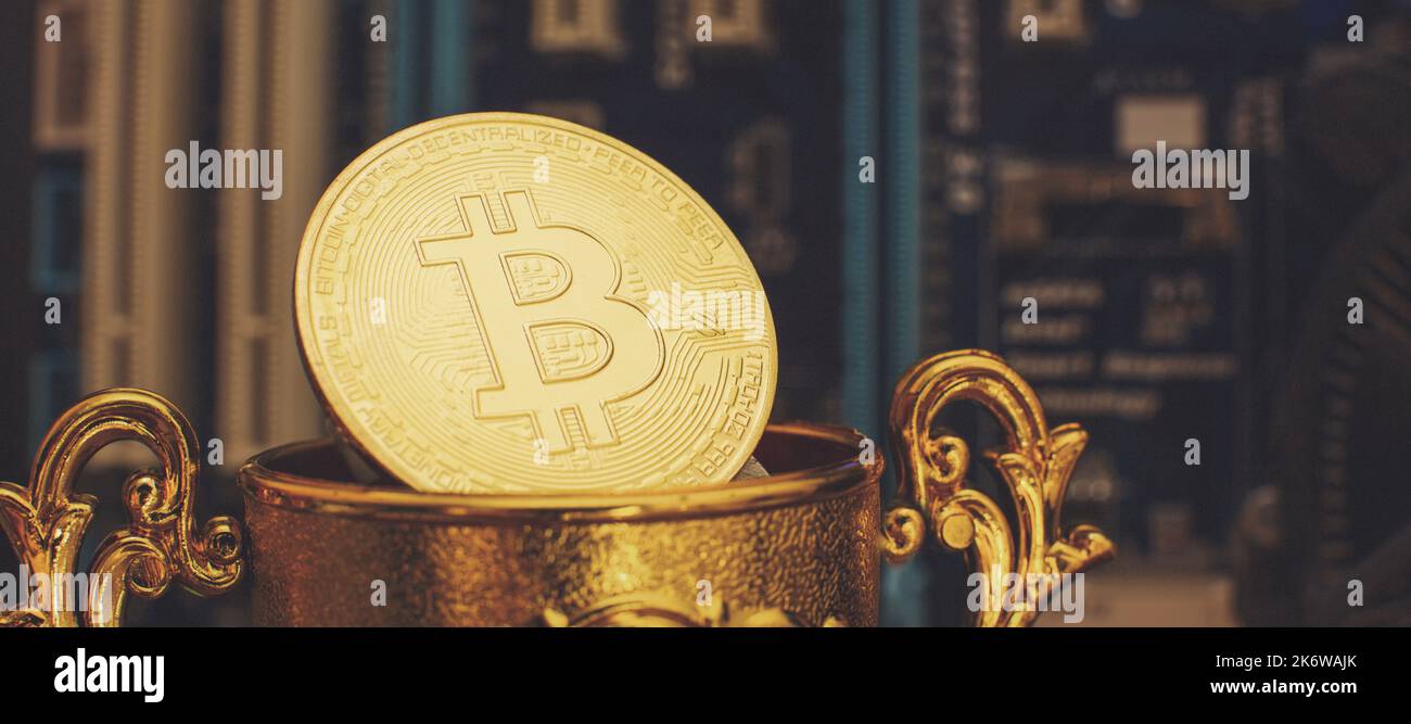 Cryptocurrency concept , Golden bitcoin on winners cup background ...