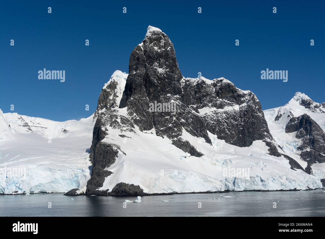 ice-capped basalt rock towers of humphries heights on cape renard ...