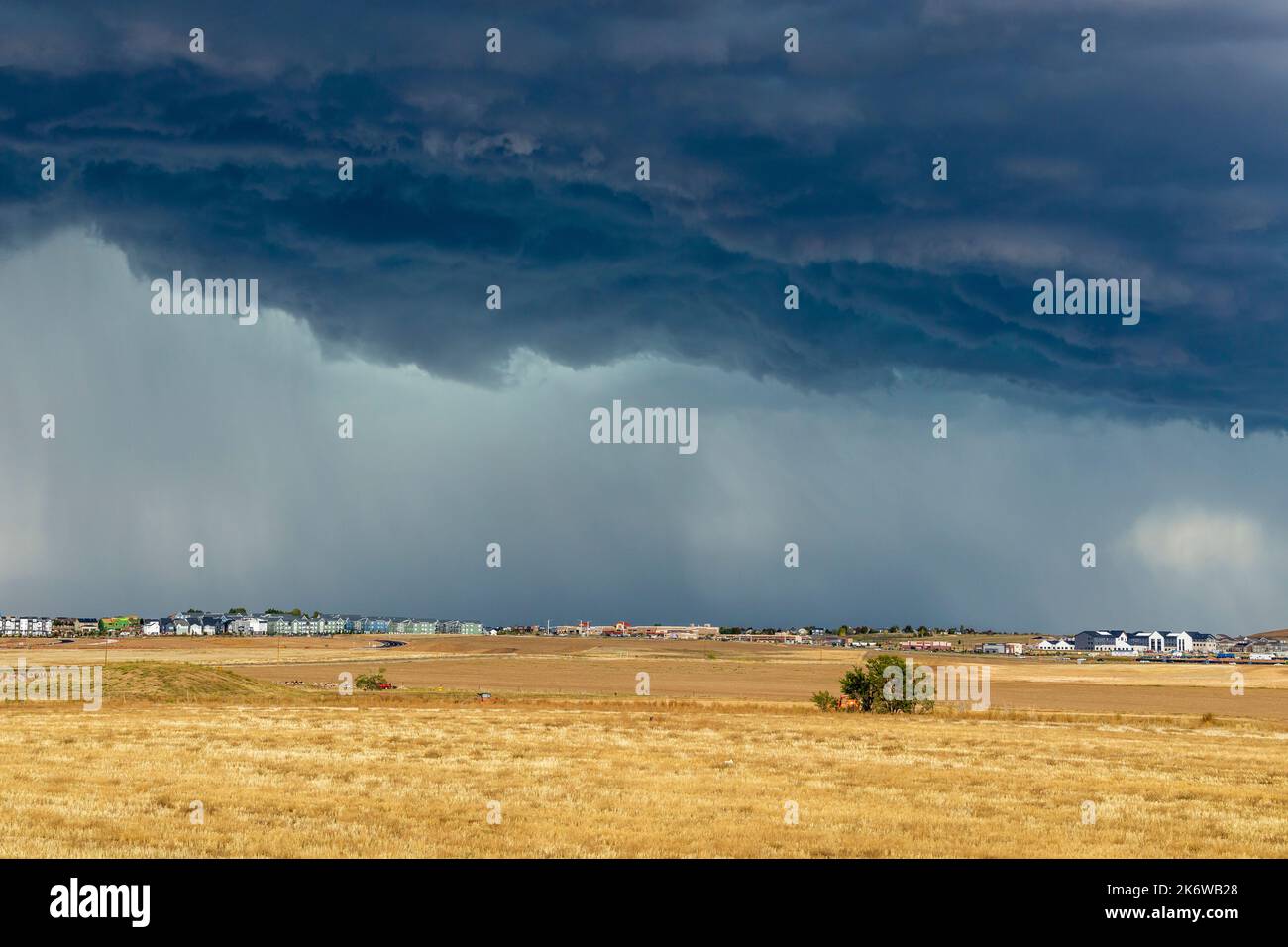 Dark storm clouds over the horizon with heavy rain on a windswept ...