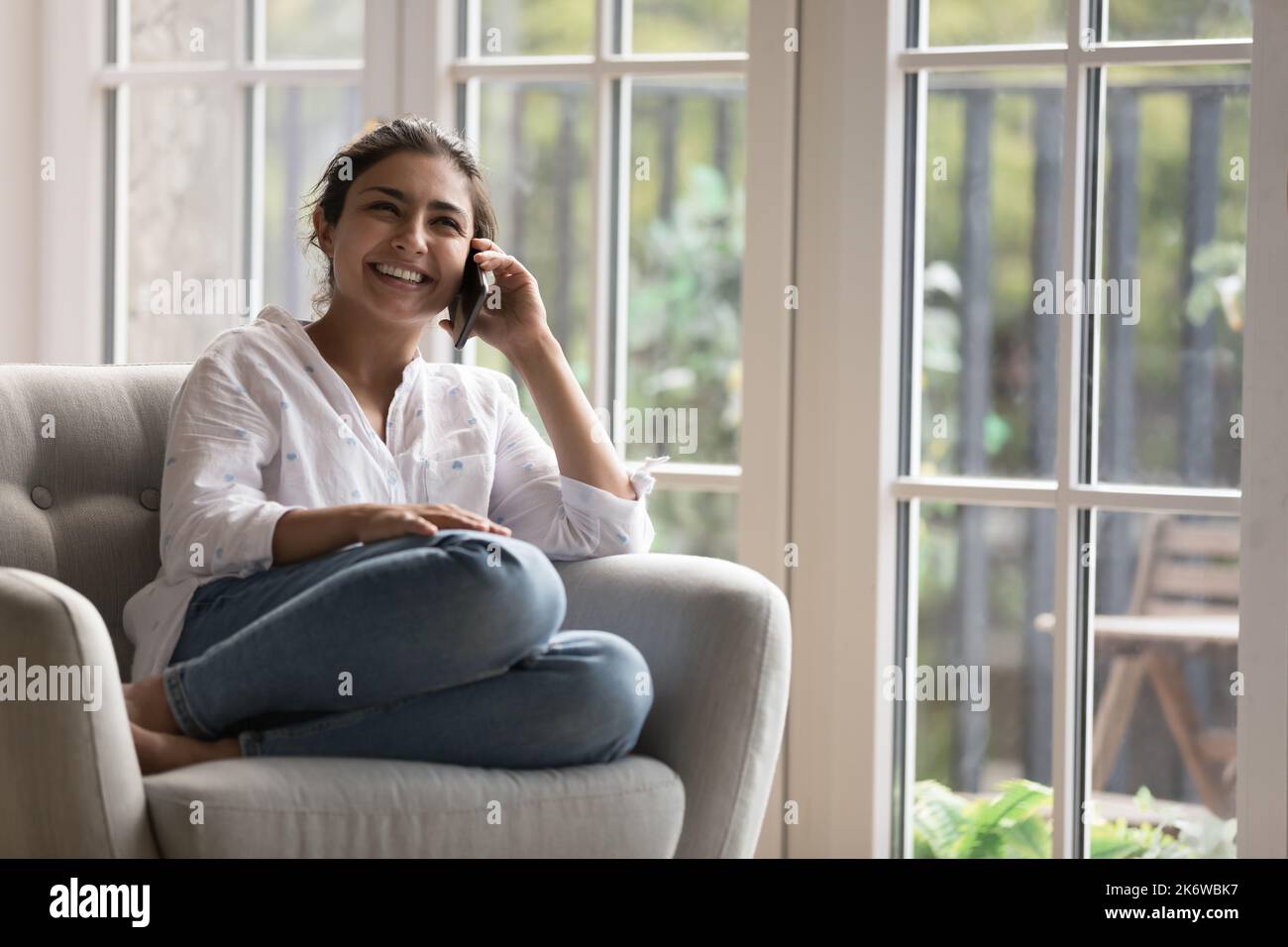 Indian woman enjoys pleasant friendly conversation on cell phone Stock ...