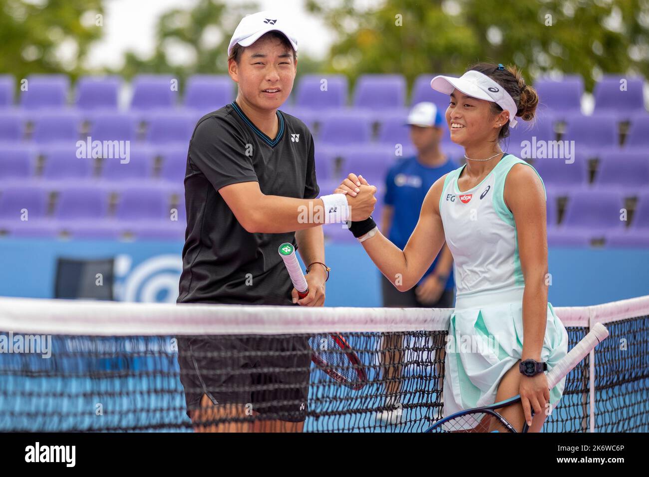 HUA HIN, THAILAND - OCTOBER 16: Zhuoxuan Bai of China is congratulated ...
