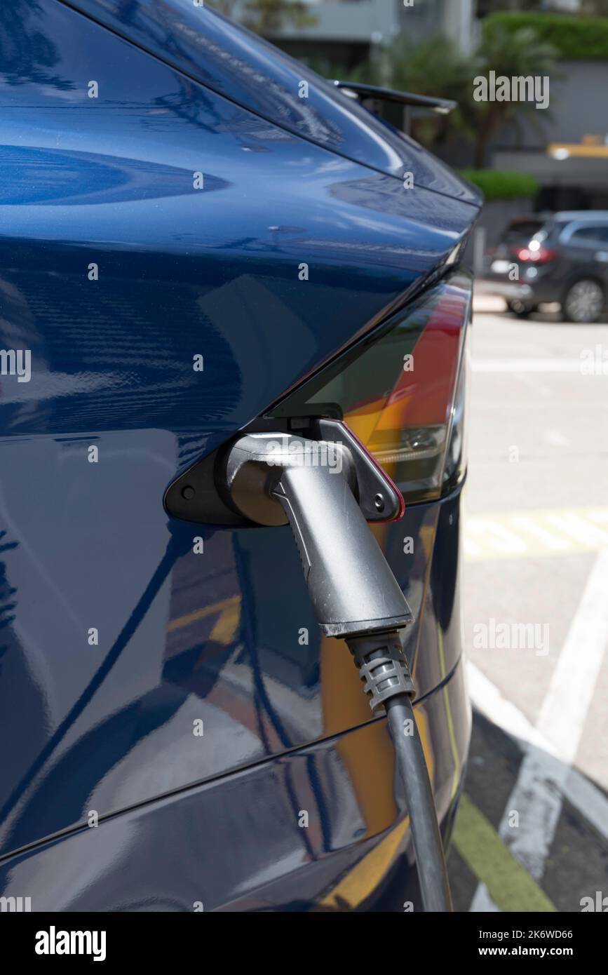 An electric vehicle (EV) being recharged in a carpark in Sydney ...