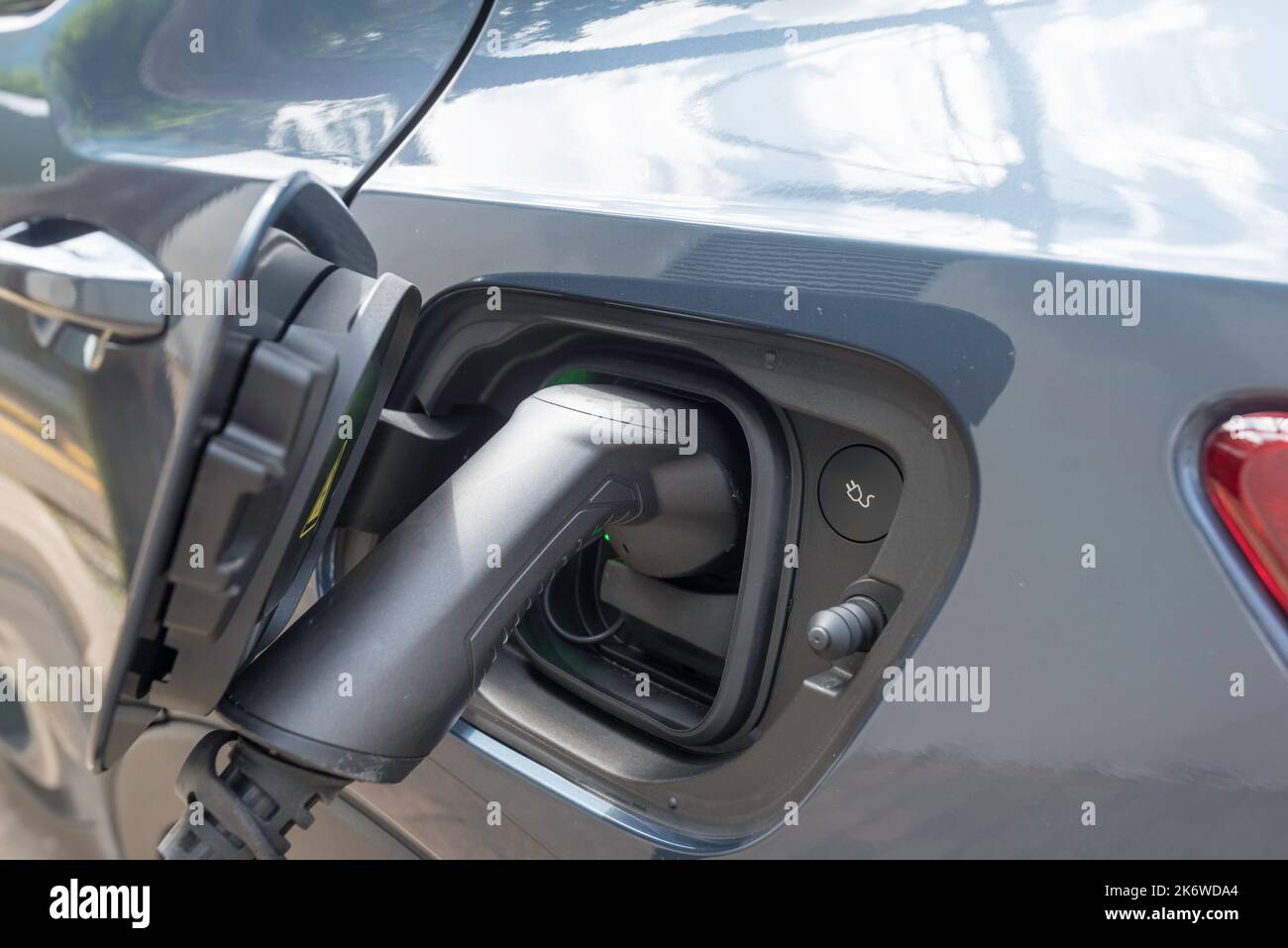 An electric vehicle (EV) being recharged in a carpark in Sydney ...