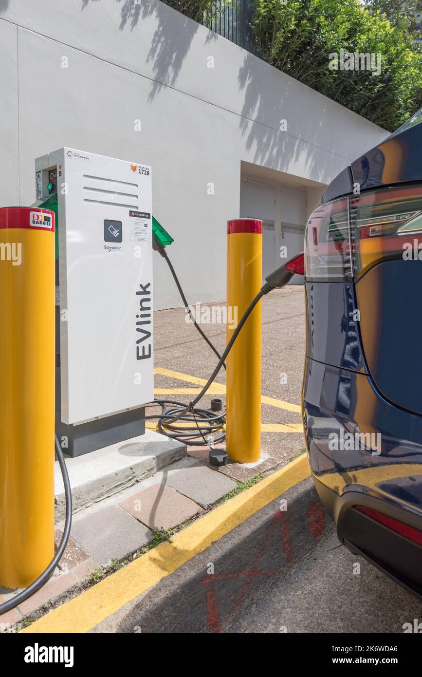 An electric vehicle (EV) being recharged in a carpark in Sydney ...