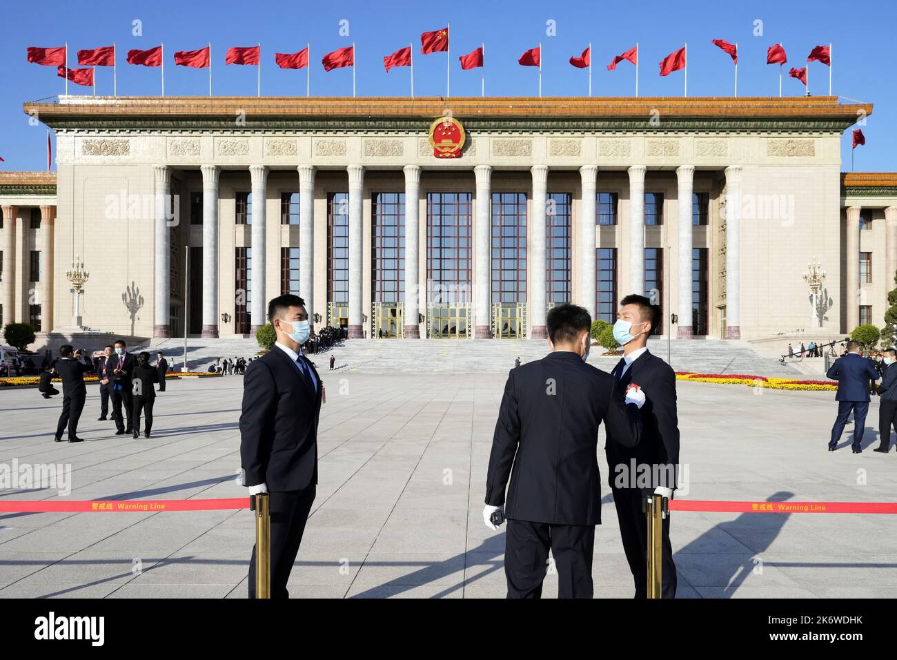 Security officers patrol in front of the Great Hall of the People in ...