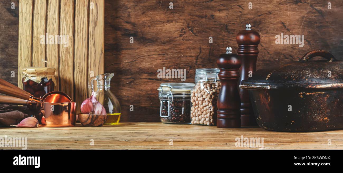 Cooking food background: rustic wood kitchen table, cast iron pan ...