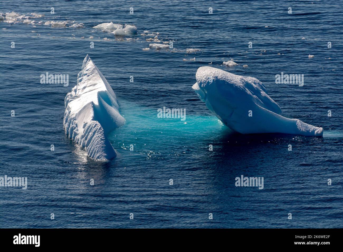 iceberg with two parts above water joined underwater. near northern ...