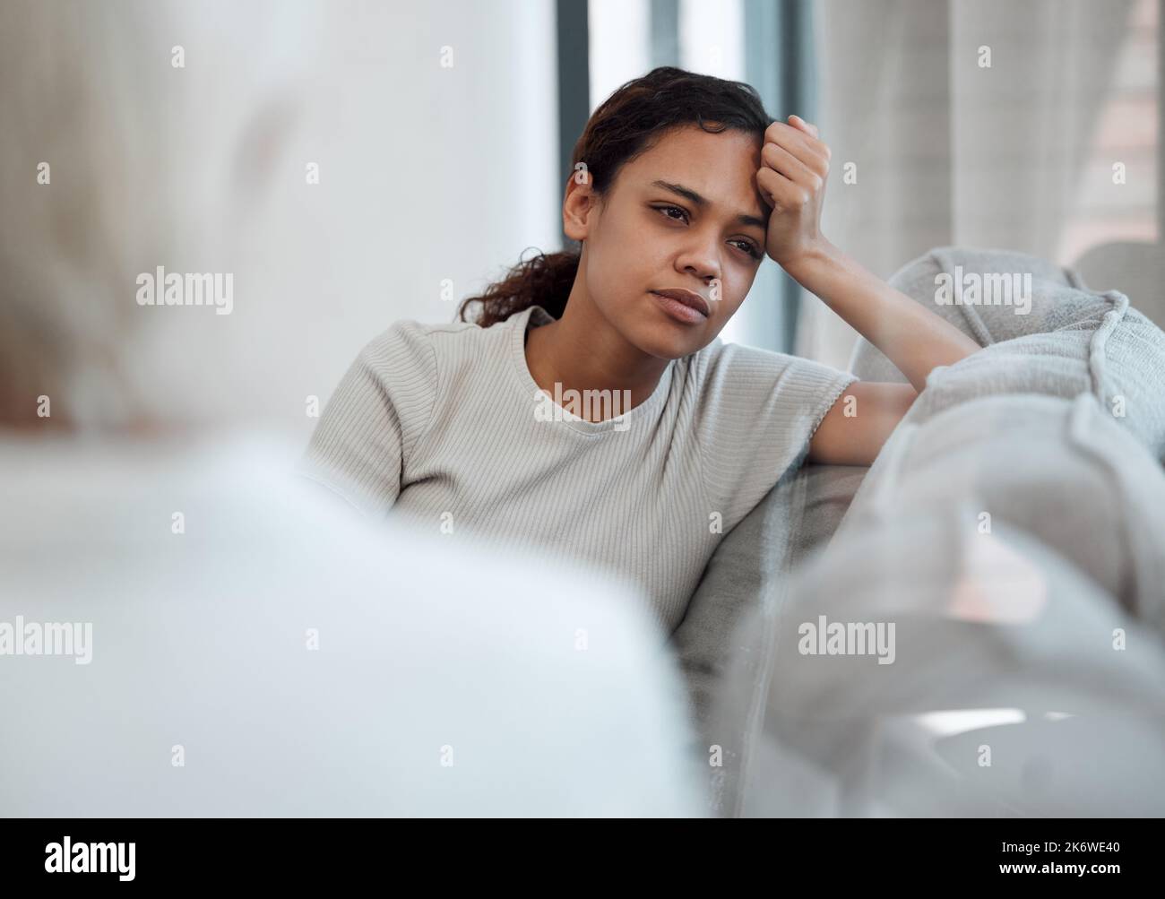 I just feel so numb. an attractive young woman sitting with her ...